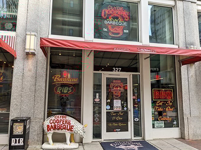 The neon glow of Clyde Cooper's storefront is like a lighthouse for hungry barbecue pilgrims, beckoning from downtown Raleigh since 1938.