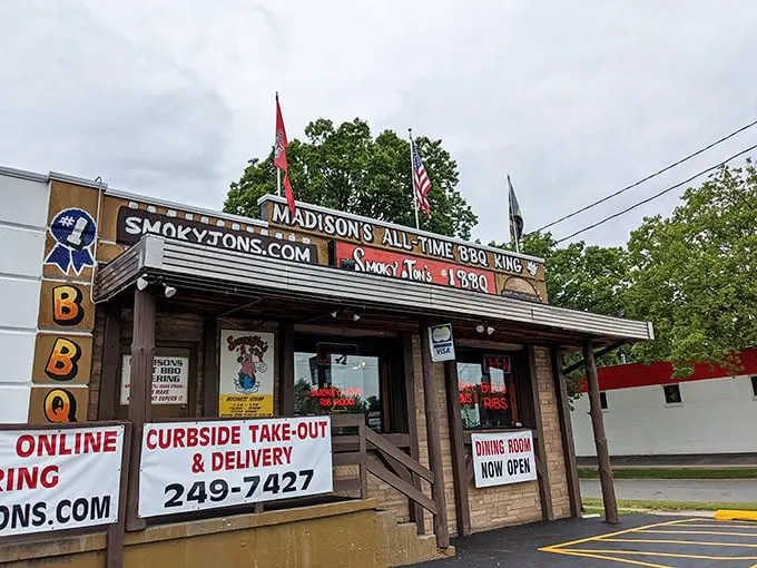 The unassuming exterior of Smoky Jon's proudly declares itself "Madison's All-Time BBQ King" – a bold claim backed by decades of smoke-infused excellence.