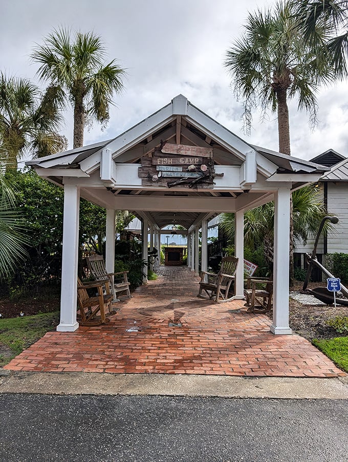 The wooden deck at Skipper's Fish Camp invites you to slow down and breathe in that coastal air. Those rocking chairs aren't just furniture—they're an invitation to linger.