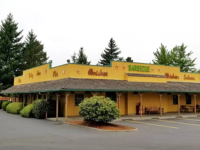 The yellow facade of Buster's stands like a Texas mirage in Oregon, promising smoked meat salvation to weary travelers.