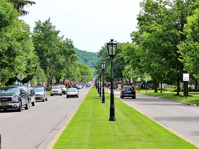 Wellsboro's iconic gas lamps line the grassy boulevard of Main Street, creating a scene straight out of a Norman Rockwell painting.