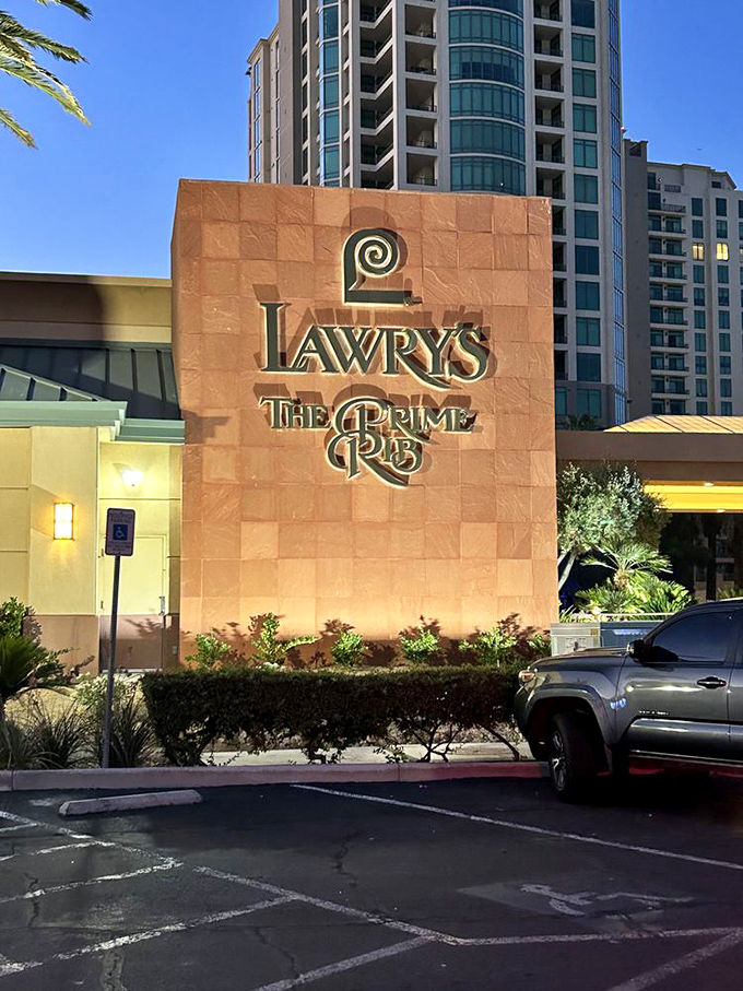 The iconic terracotta facade of Lawry's stands proudly against the Vegas sky, promising carnivorous delights within—a meaty oasis amid the neon desert.