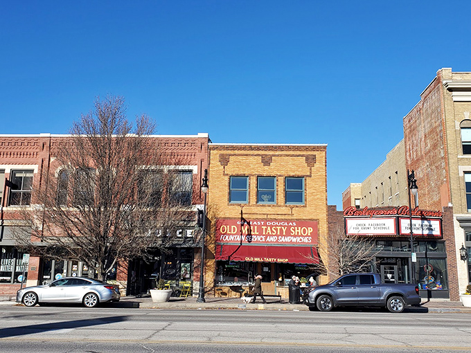 The Old Mill Tasty Shop's brick façade stands proudly on Douglas Avenue, a time capsule of Americana that's been satisfying Wichita's comfort food cravings for generations.