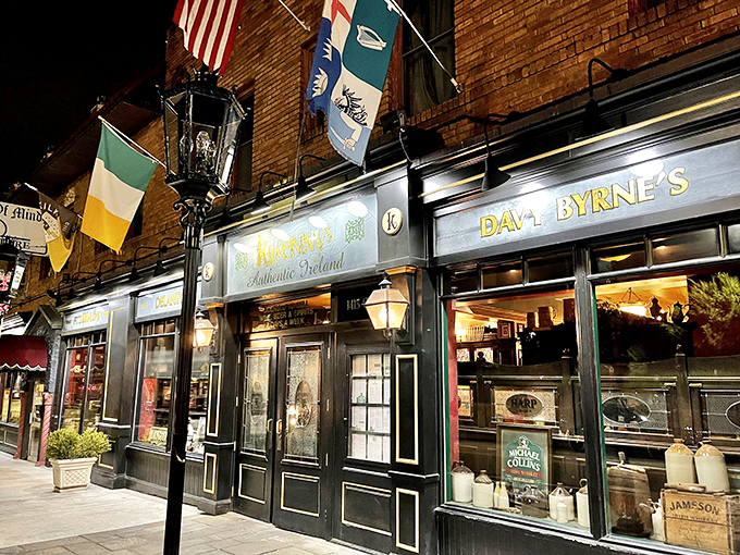 The emerald flags flutter like a Dublin welcome above Kilkenny's façade. At night, the warm glow beckons hungry travelers into this slice of Ireland in Tulsa.