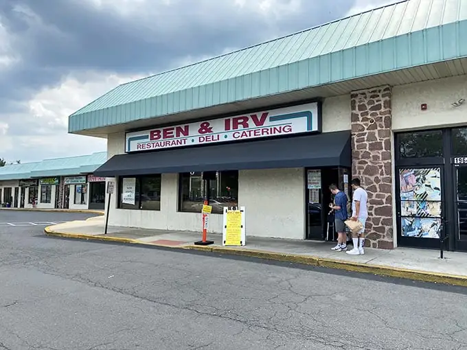 The unassuming exterior of Ben & Irv's hides culinary treasures within. That teal roof has sheltered sandwich seekers for generations.