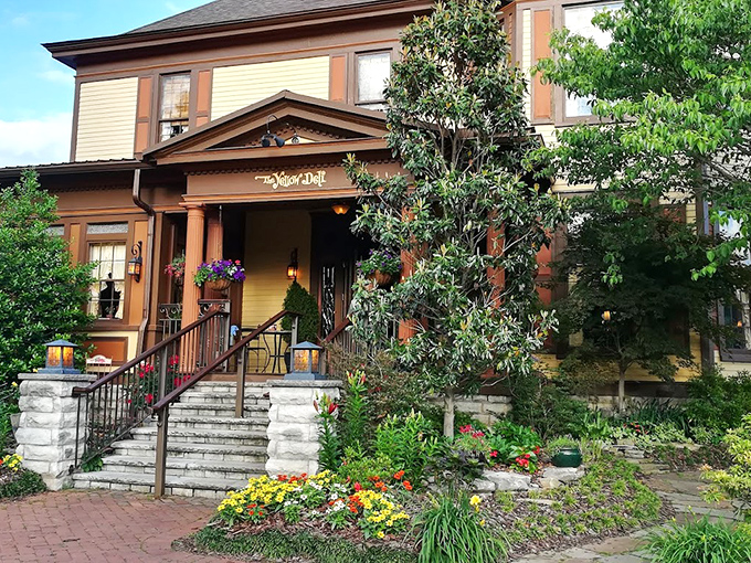 
 The Yellow Deli's historic façade welcomes you with stunning stone steps and vibrant gardens—like a Tennessee postcard come to life.