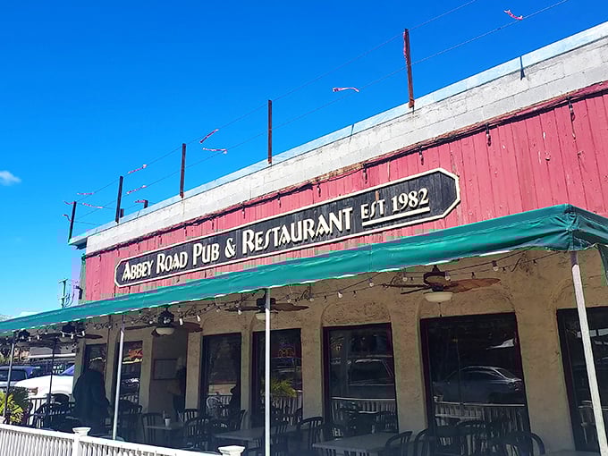 The Beatles would be proud! Abbey Road Pub's colorful exterior mural announces its musical inspiration while promising British comfort food with an oceanside twist.