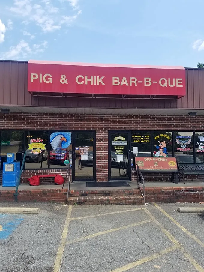 The bright red sign beckons like a barbecue lighthouse in a sea of hunger. No fancy frills here—just the promise of smoky delights waiting inside.