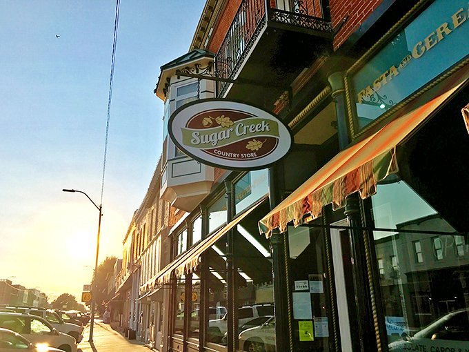 The historic brick façade of Sugar Creek Country Store beckons like an old friend, promising delicious treasures behind that charming wooden door.