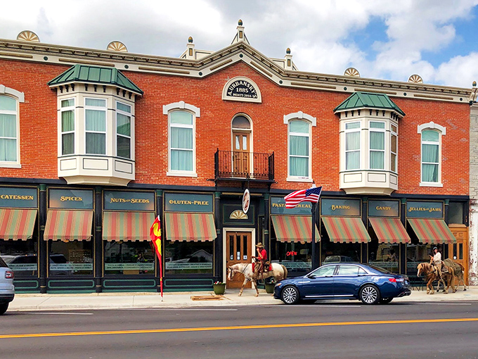 The historic brick façade of Sugar Creek Country Store beckons like an old friend, promising delicious treasures behind that charming wooden door.