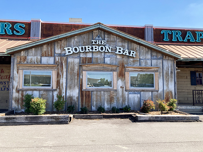 The weathered wooden exterior of Trapper's Fishcamp & Grill looks like it was teleported straight from a Louisiana bayou to Oklahoma City. Pure rustic charm!