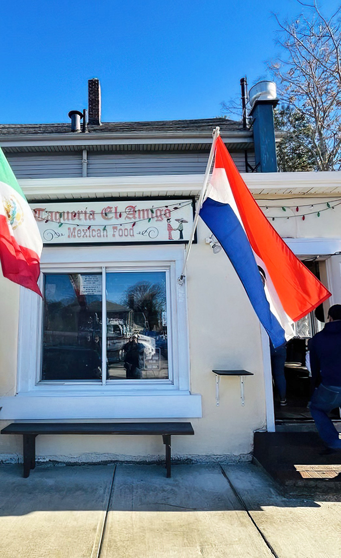 The unassuming exterior of Taqueria El Amigo might fool you, but that "TACOS" flag is actually the culinary equivalent of "Treasure Found Here!"