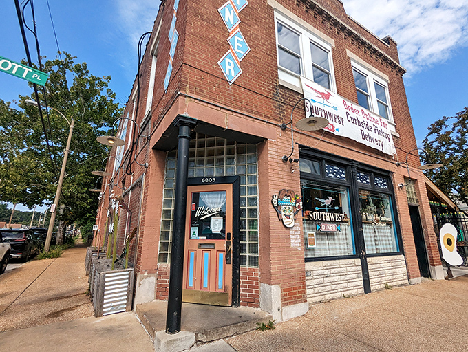 The unassuming brick exterior hides a southwestern flavor explosion within, where the patio's colorful chairs hint at the vibrancy waiting inside.
