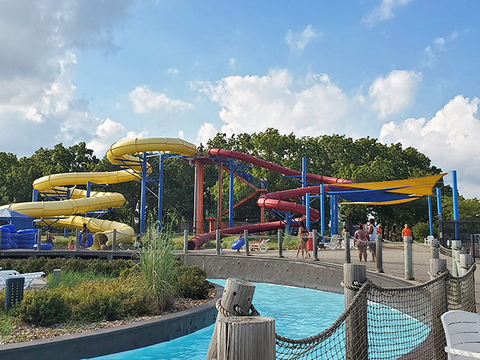 Colorful water slides twist against the Missouri sky like a tangle of primary-colored pasta, promising thrills that'll make adults question their life choices—gloriously.