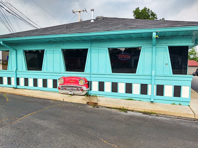 That unmistakable turquoise exterior isn't just a building—it's a time portal disguised as a diner. The Dairy Dip's vintage sign practically winks at passersby.