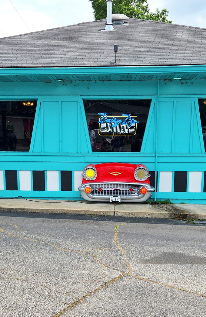 That unmistakable turquoise exterior isn't just a building—it's a time portal disguised as a diner. The Dairy Dip's vintage sign practically winks at passersby.