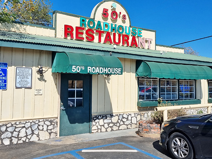 The classic roadside charm of 50's Road House beckons with its vibrant signage and green awnings—a time portal disguised as a restaurant in Knights Ferry.
