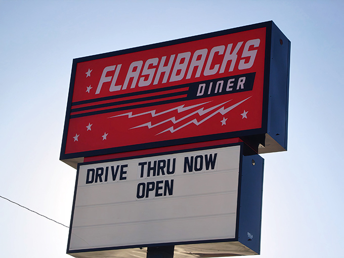 That iconic red sign against the Kansas sky promises more than just a meal—it's a ticket to simpler times when drive-ins ruled the roadside.