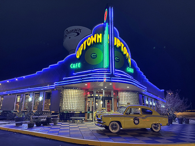 The neon-drenched Art Deco façade of Jackie B. Goode's glows like a beacon for hungry time travelers, complete with that perfect vintage yellow cab parked outside.