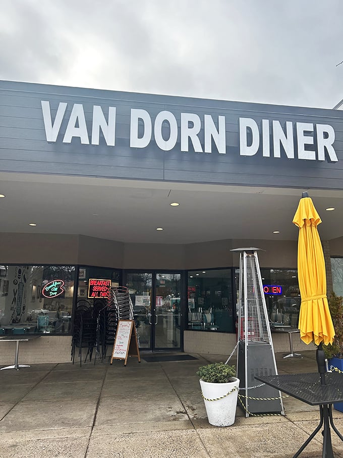 The retro signage beckons like a time machine with a lunch special. Van Dorn Diner's exterior promises a journey back to when calories didn't count and jukeboxes ruled.