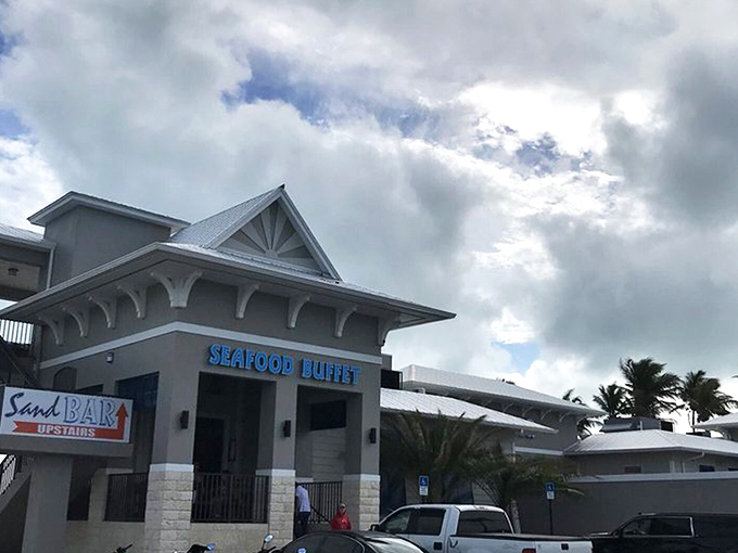 The coastal charm of Whale Harbor beckons seafood lovers with its distinctive blue signage and Keys-style architecture. Paradise found at mile marker 83.5!