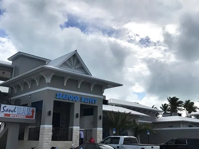The coastal charm of Whale Harbor beckons seafood lovers with its distinctive blue signage and Keys-style architecture. Paradise found at mile marker 83.5!