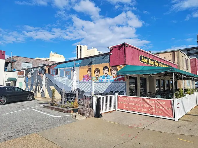 The Beatles would be proud! Abbey Road Pub's colorful exterior mural announces its musical inspiration while promising British comfort food with an oceanside twist.