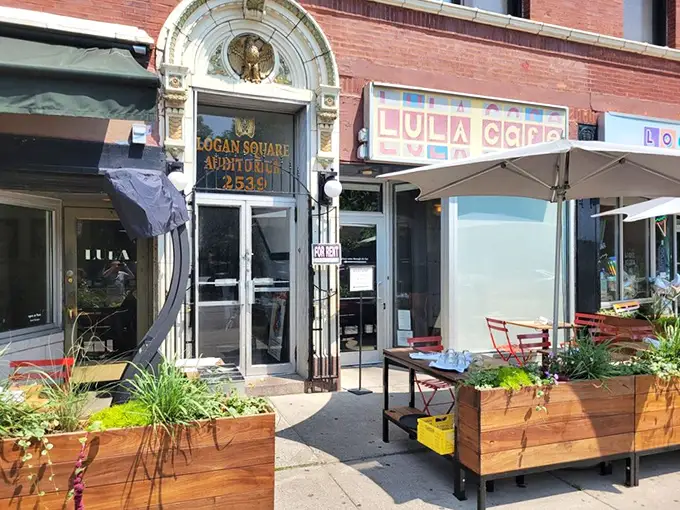 Logan Square's architectural gem houses culinary magic. That ornate entrance and colorful sign promise something special before you even taste a bite.