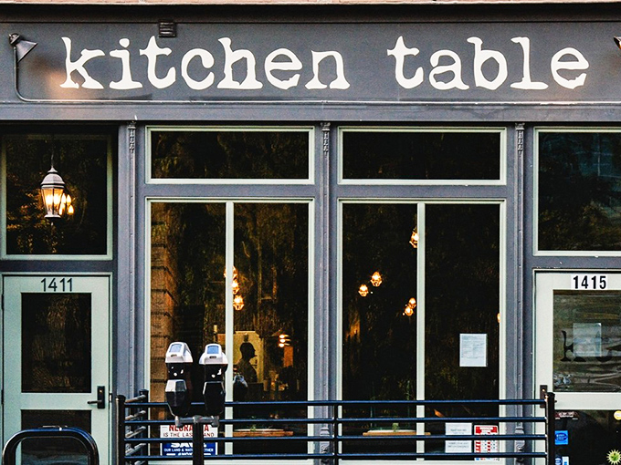 The unassuming storefront belies the culinary treasures within. Like finding a secret jazz club, Kitchen Table's exterior promises those in-the-know something special awaits. 