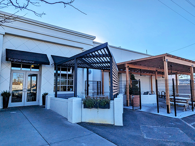The wooden slat exterior of The Grove isn't just stylish—it's a preview of the warmth waiting inside, like a delicious secret the building can barely contain.