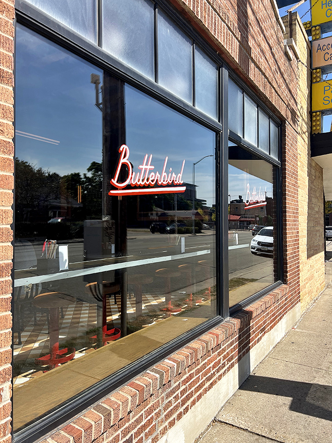 The glowing "BUTTERBIRD" sign against brick is Madison's bat signal for fried chicken enthusiasts. Simple, unassuming, and hiding delicious secrets within.