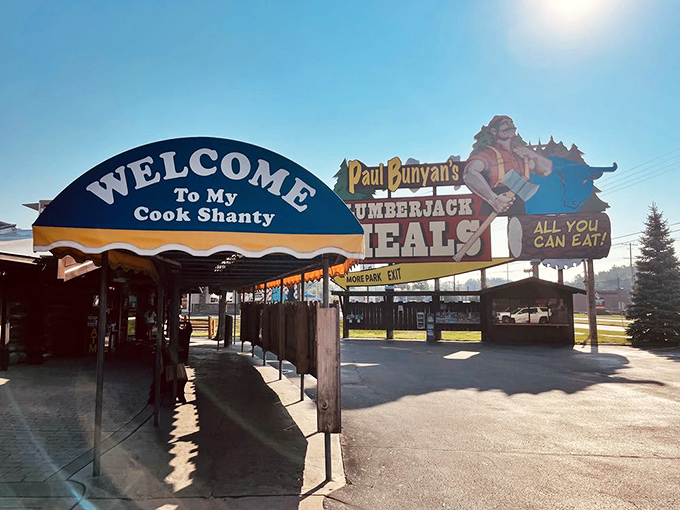 The legendary Paul Bunyan welcomes hungry travelers with a sign that practically shouts "FOOD!" louder than a lumberjack yelling "TIMBER!"