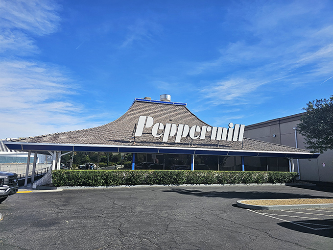 The iconic pagoda-style roof of Peppermill stands like a neon oasis amid the desert of Vegas excess, promising comfort food salvation 24/7.