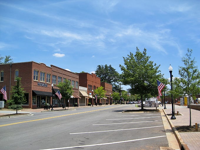 Downtown Madison's brick storefronts stand at attention like well-dressed Southern gentlemen, American flags fluttering in the Georgia breeze.