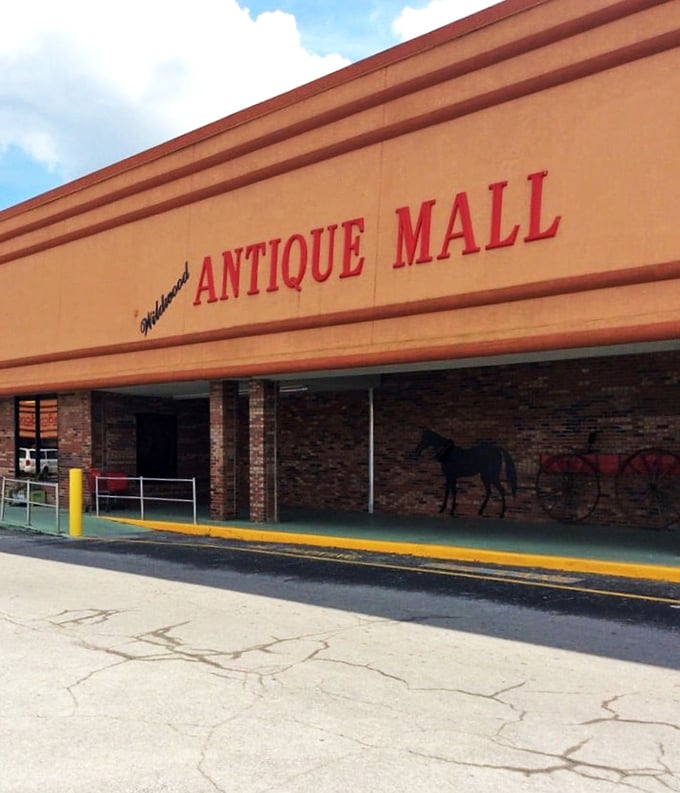 The unassuming exterior of Wildwood Antique Mall hides a universe of treasures within, like finding the Tardis of vintage shopping in Central Florida.