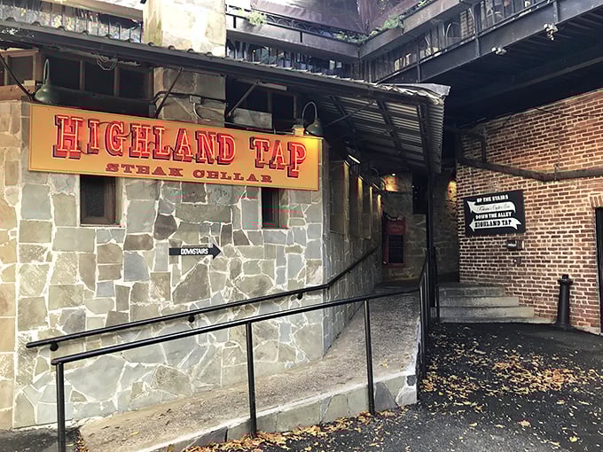 The entrance to Highland Tap beckons like a speakeasy from another era. Stone walls and that iconic burgundy awning promise carnivorous delights below street level.