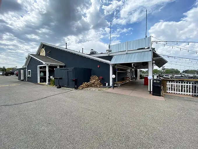 The navy blue exterior of Boathouse Kitchen & Swan Dive stands proud against Indiana's sky like a nautical oasis in a sea of cornfields.