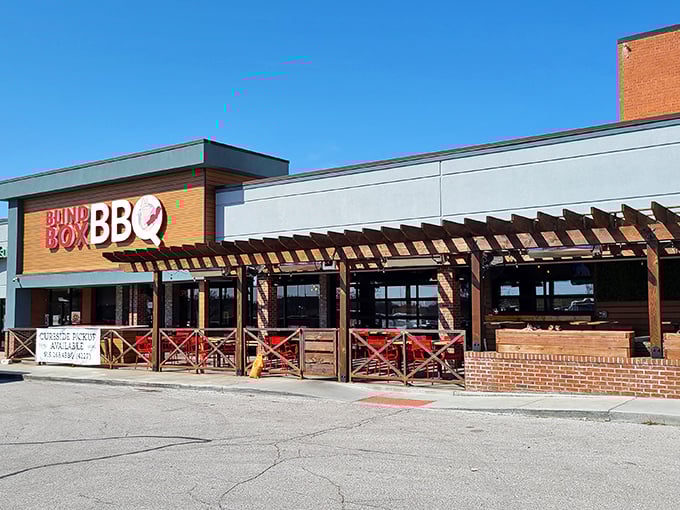 The bright orange facade of Blind Box BBQ stands out like a beacon for hungry barbecue pilgrims. No smoke signals needed—you can smell the goodness from the parking lot.