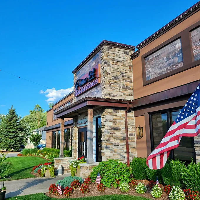 Stone facade, lush landscaping, and an American flag – Prime 94 announces itself with the confidence of a restaurant that knows exactly what it's doing.