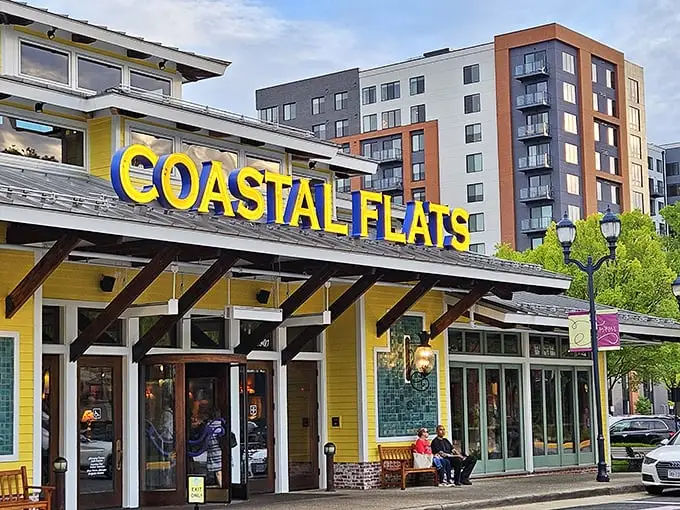 The sunshine-yellow exterior of Coastal Flats stands out in Fairfax like a beach house that took a wrong turn at Virginia Beach and decided to stay.