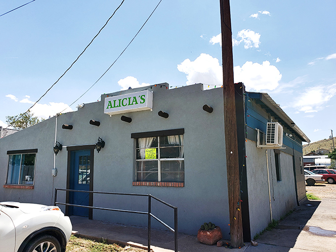 The unassuming exterior of Alicia's might fool you, but that blue door is basically a portal to flavor country. No fancy frills needed.
