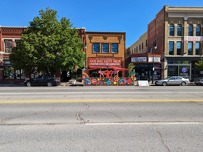 The Old Mill Tasty Shop's brick façade stands proudly on Douglas Avenue, a time capsule of Americana that's been satisfying Wichita's comfort food cravings for generations.
