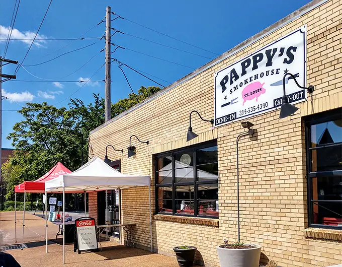 The unassuming yellow brick exterior of Pappy's Smokehouse – where BBQ pilgrims willingly make the journey for meat nirvana.