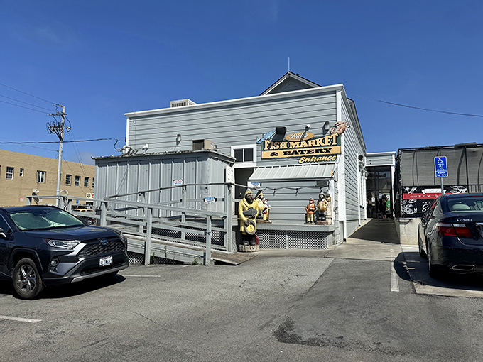 The unassuming blue exterior of Phil's Fish Market & Eatery stands like a salty sea captain – weathered, unpretentious, and hiding treasures within.