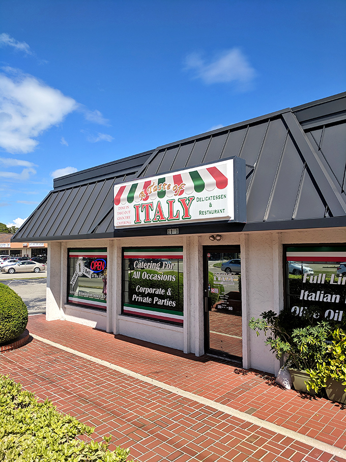 The unassuming storefront that launched a thousand food pilgrimages. Italian colors proudly announce what awaits inside: culinary authenticity without pretense.