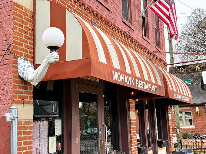 The iconic red-brick facade and striped awnings of The Old Mohawk aren't just charming—they're a beacon for sandwich pilgrims seeking salvation between two slices of bread.