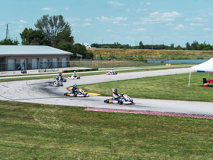 Where speed dreams are born! Racers navigate the pristine curves of New Castle's world-class track under Indiana's endless blue skies.