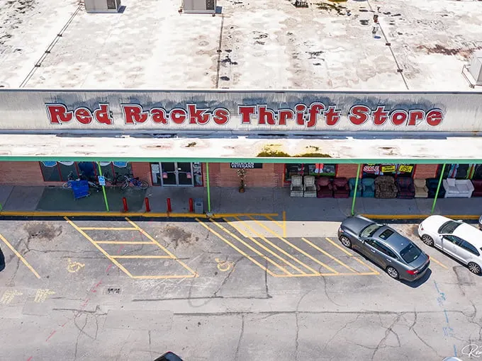 The bright red signage promises treasure within these walls, where bargain hunters and do-gooders unite in the pursuit of secondhand glory.