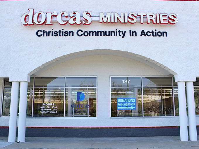 The welcoming façade of Dorcas Ministries invites treasure hunters with its clean white exterior and clear signage about donation procedures and store hours.