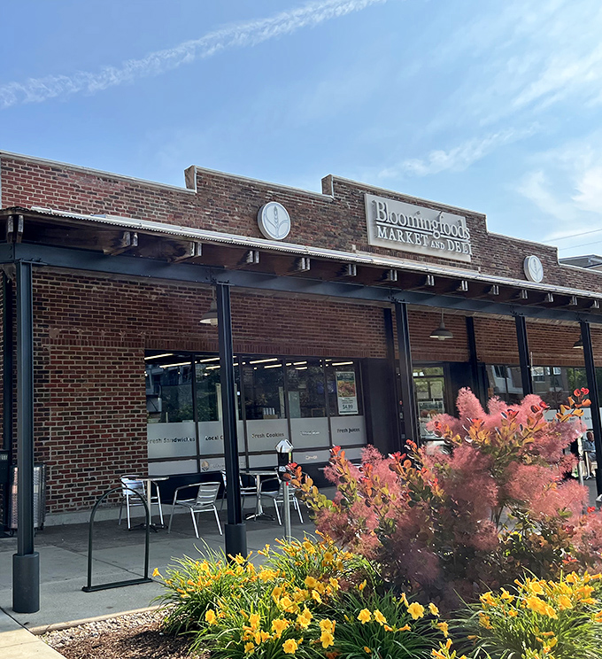 The unassuming brick exterior of Bloomingfoods East hides culinary treasures within, like a delicious secret waiting to be discovered by hungry passersby.